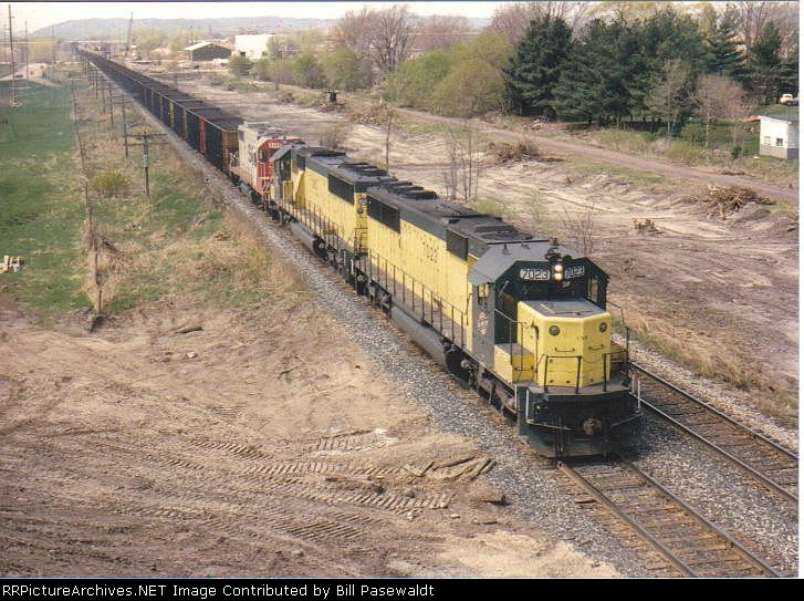 A pair of SD50s get help from a SOO dash 2
